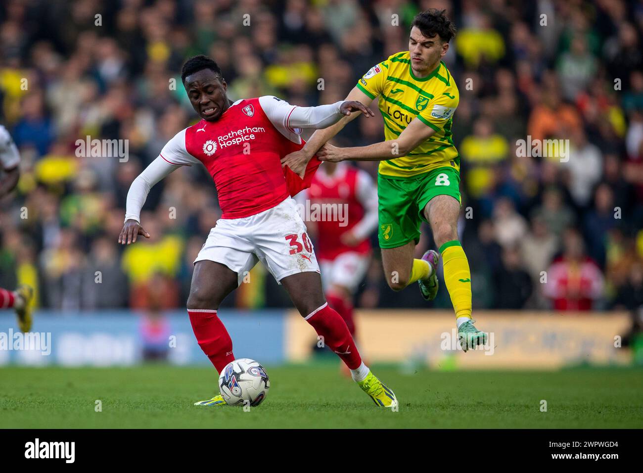 Arvin Appiah of Rotherham United on the ball with pressure from Liam ...
