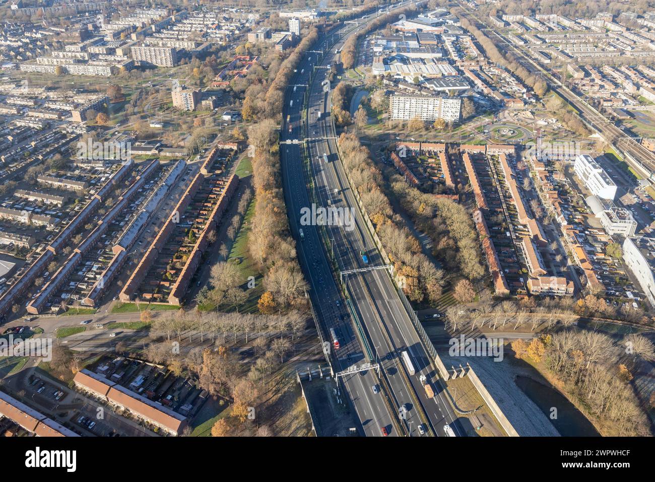 Aerial view flying above Dutch highway A16 near village of Zwijndrecht ...