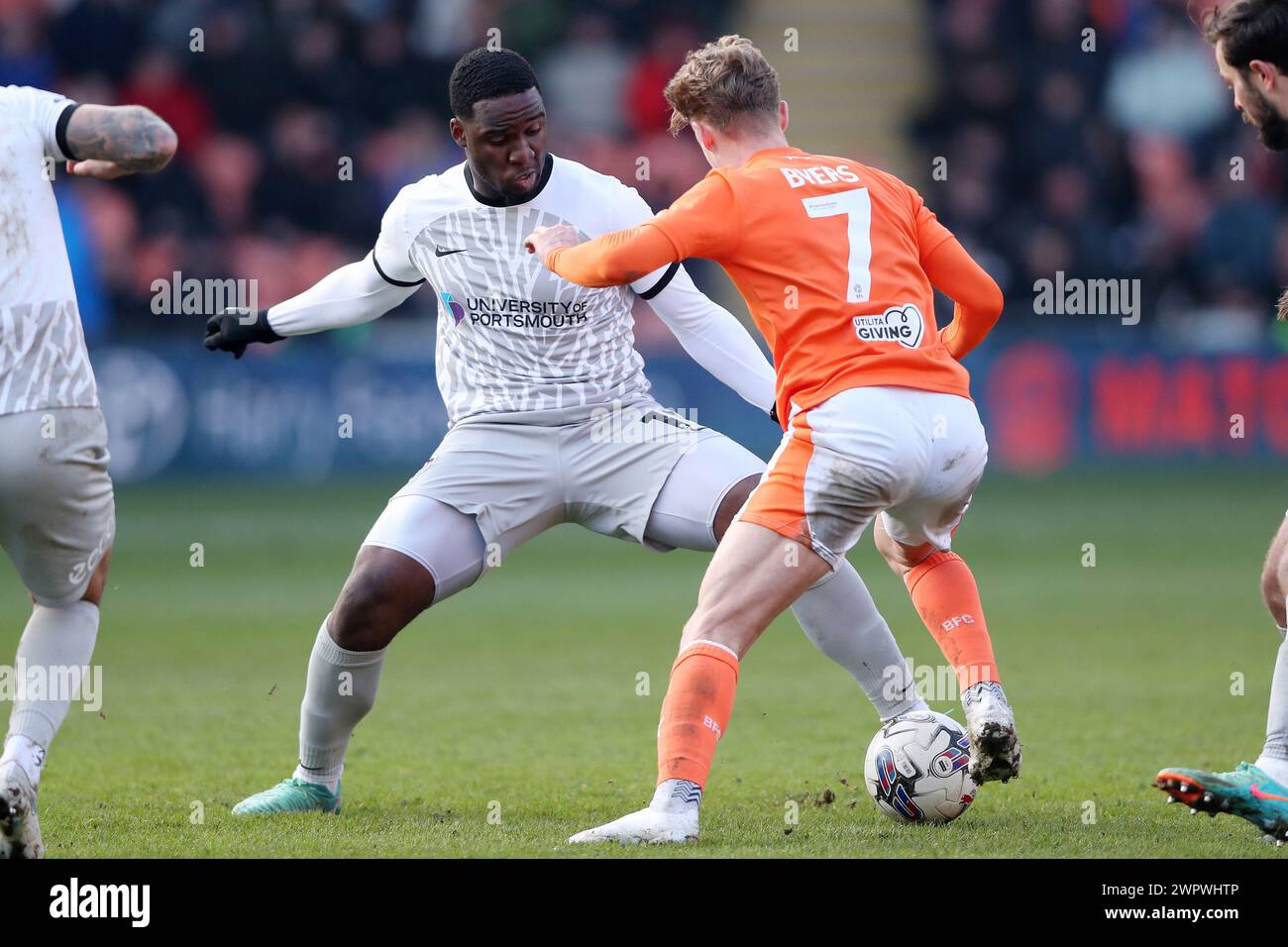 Portsmouth's Christian Saydee (left) and Blackpool's George Byers ...