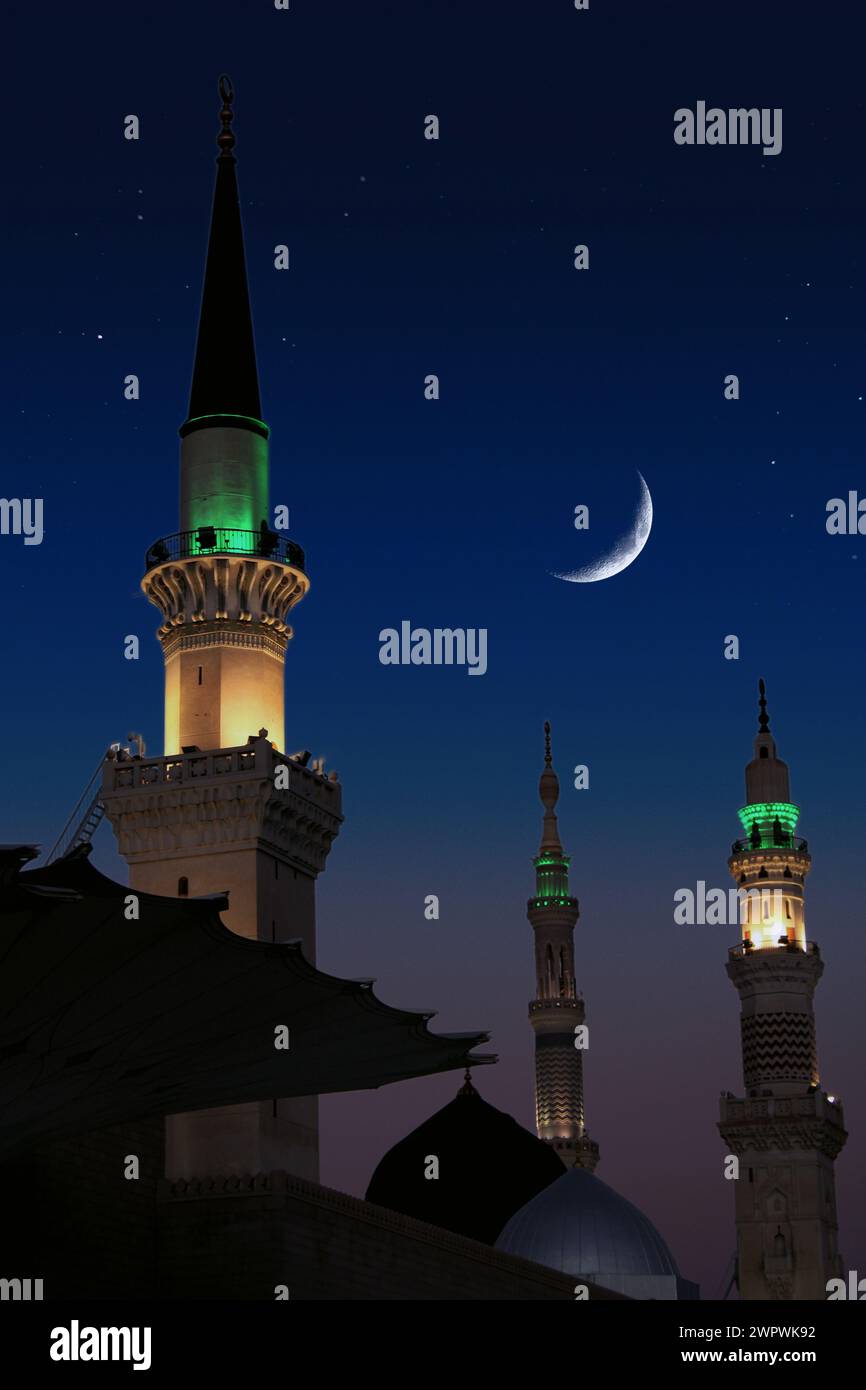 A mosque with the full moon in the sky. Masjid nabi of Medina, mosque ...