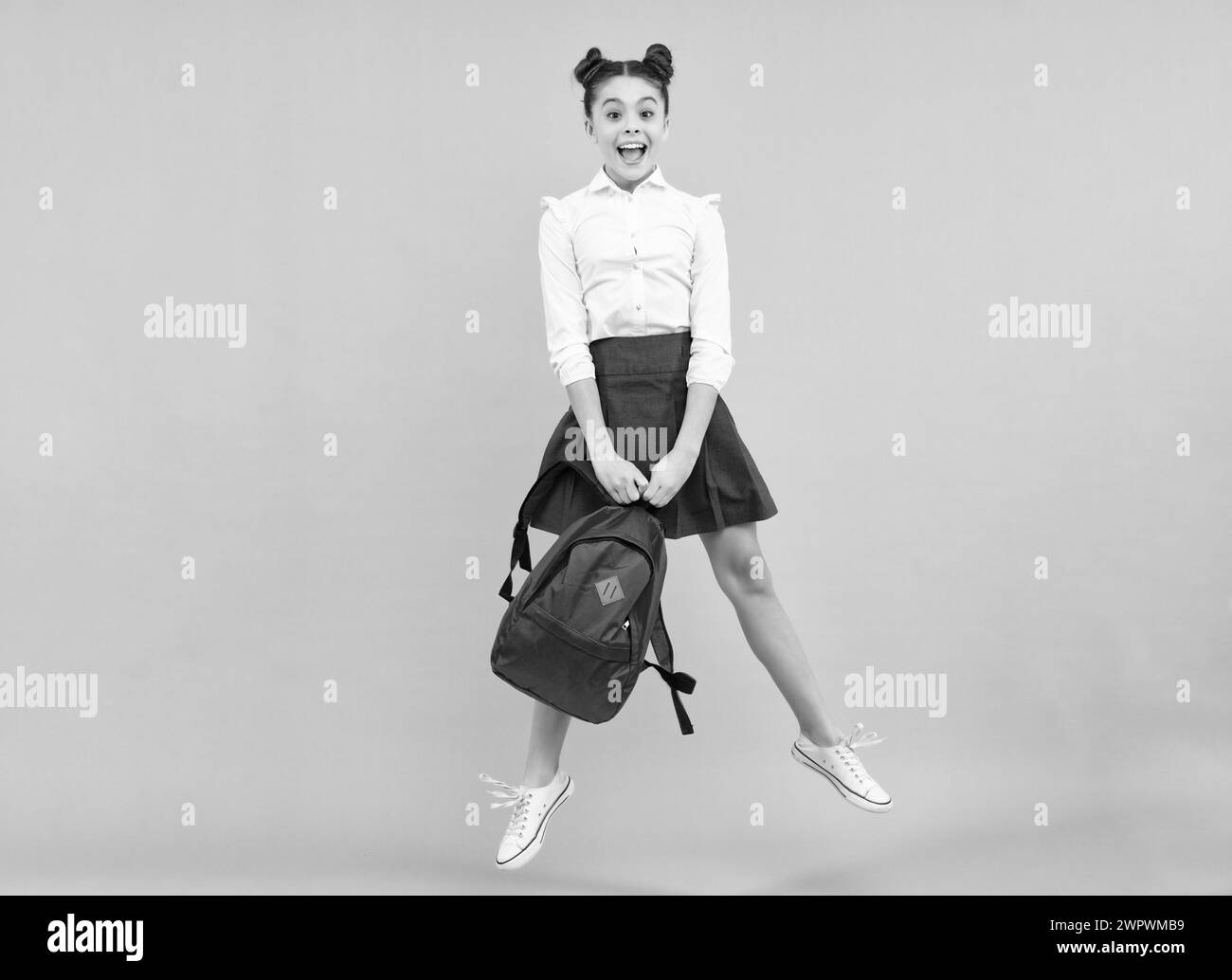 Amazed teenager. Back to school. Teenager schoolgirl in school uniform ...