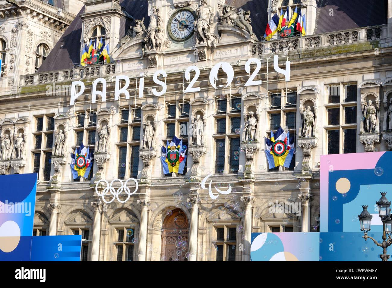 The Olympic and Paralympic symbols are on display at Paris City Hall ...