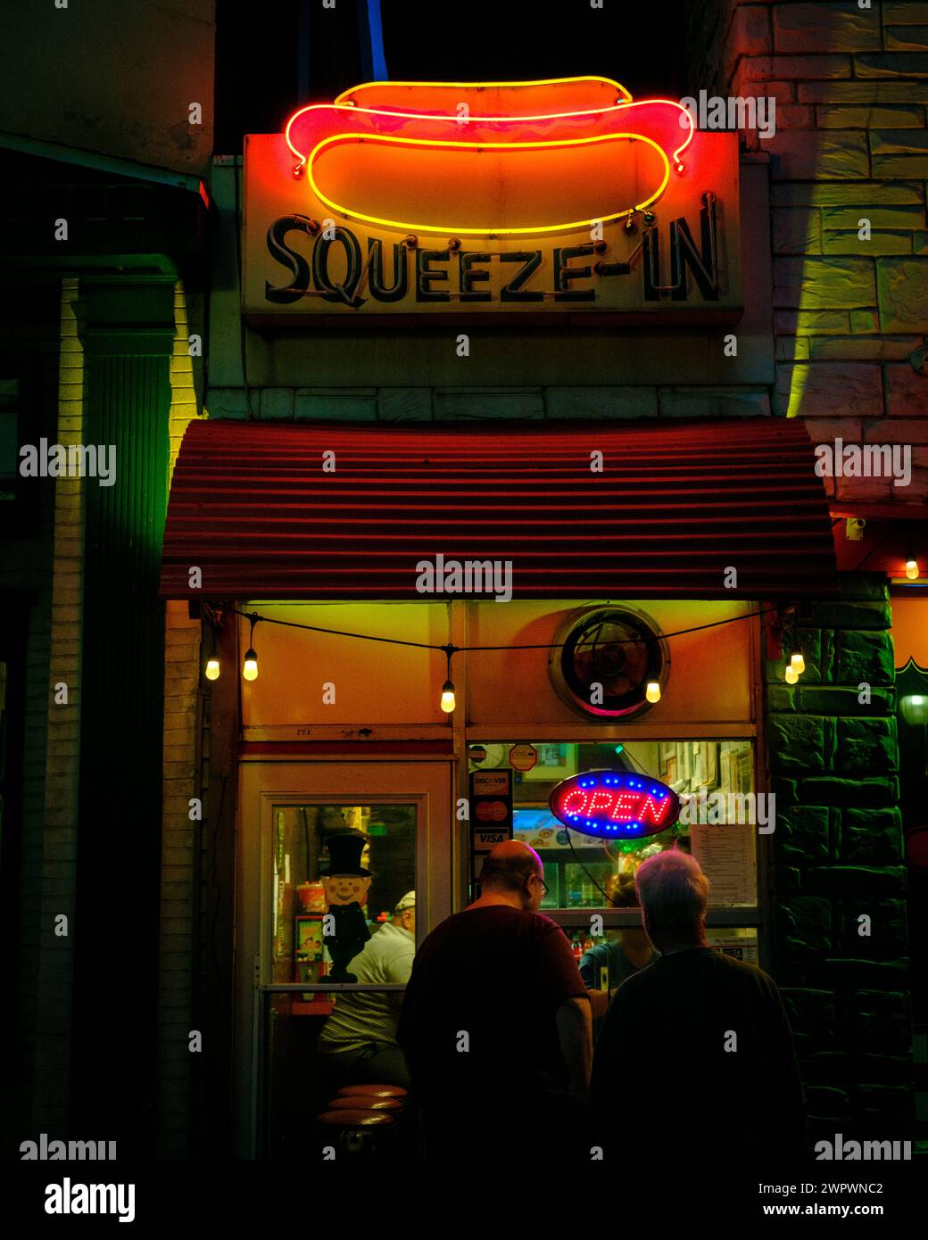 The Squeeze-In vintage neon sign at night, Sunbury, Pennsylvania Stock ...