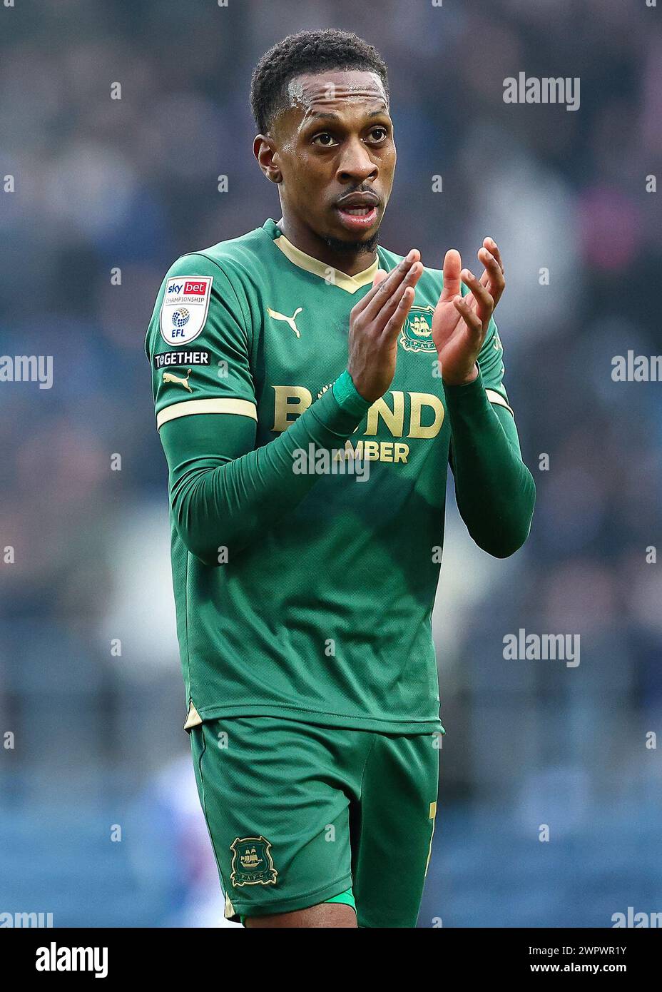 Mickel Miller of Plymouth Argyle applauds the fans at full time and ...