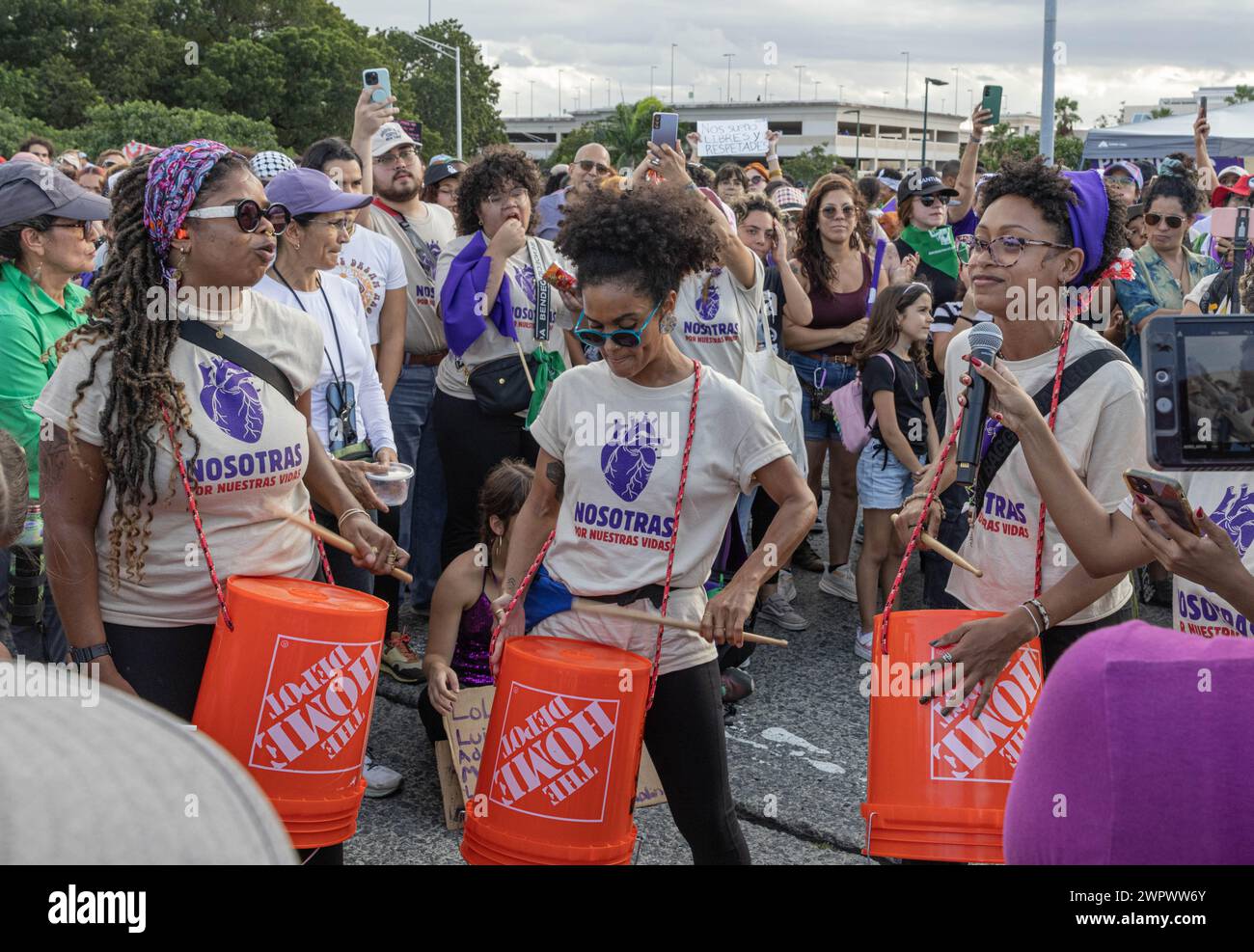 Feminist activists perform a drum circle during a march to commemorate ...