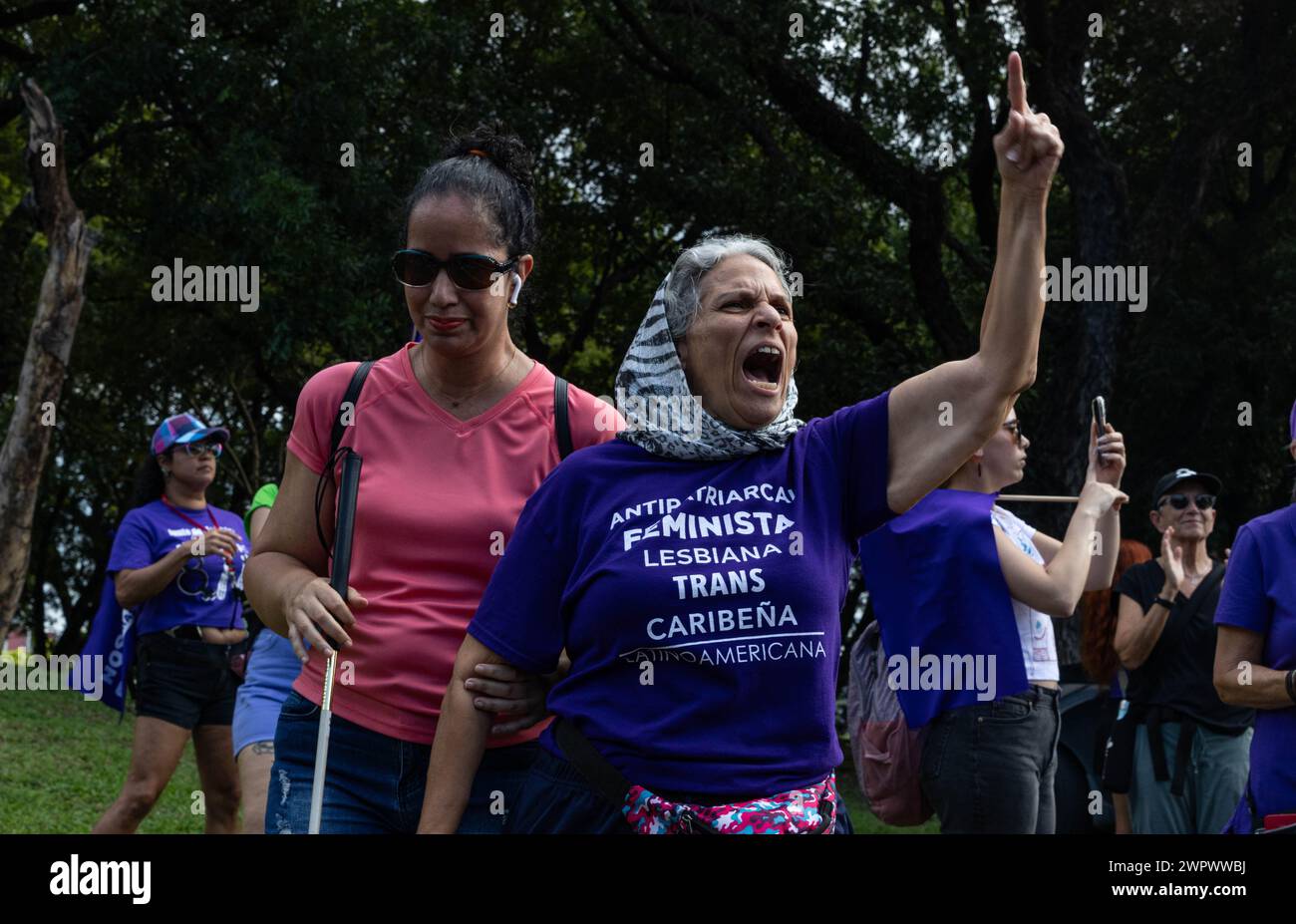 “We demand accountability,” an elderly feminist activist chants during ...