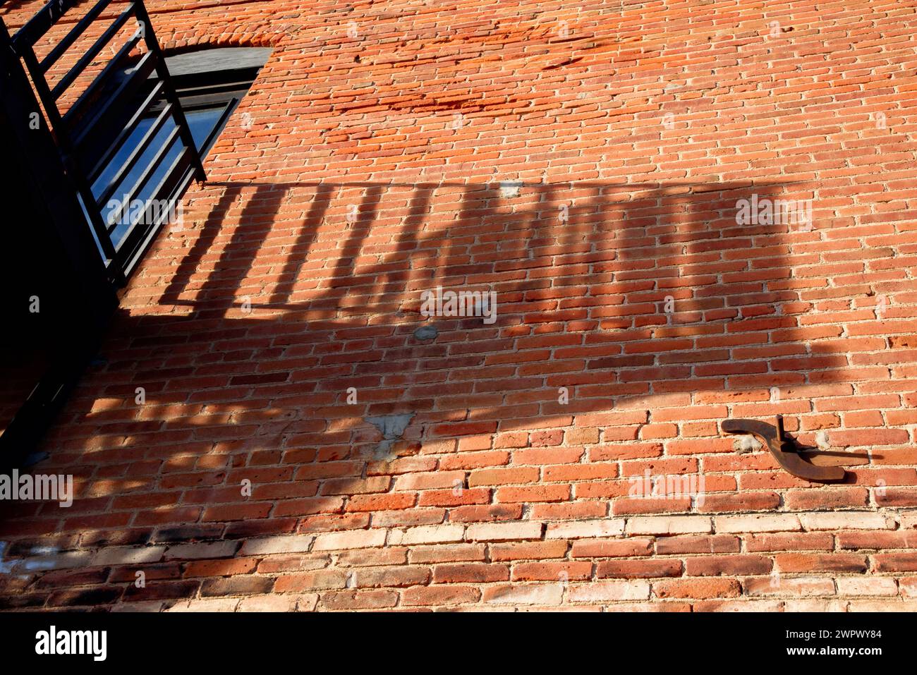 Fire escape shadow Stock Photo - Alamy