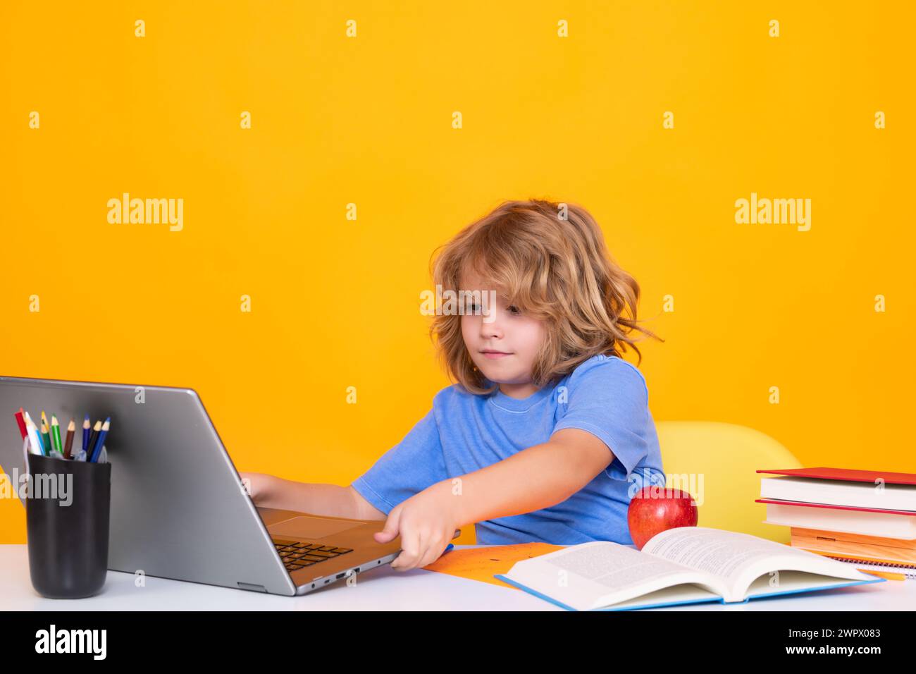 School child using laptop computer. School and kids. Cute blonde child ...
