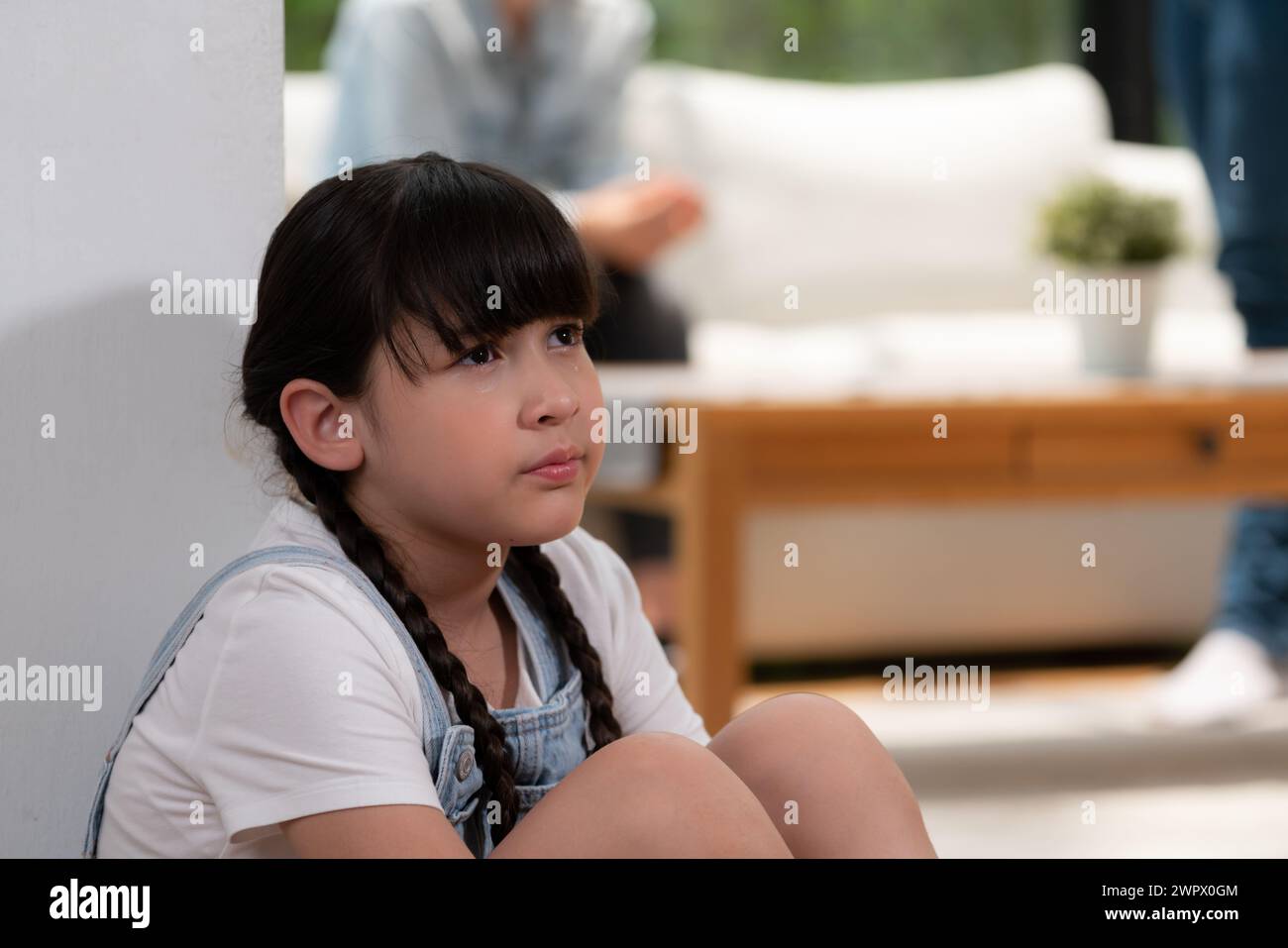 Stressed and unhappy young girl huddle in corner crying and sad while ...
