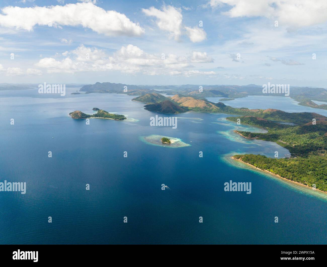 Aerial view of CYC Beach and Dimanglet Island with blue sea. Lajala ...