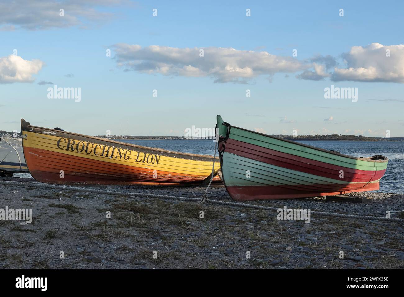 Numerous boats dot the beach and sand at Hull, Mass. it's a very ...