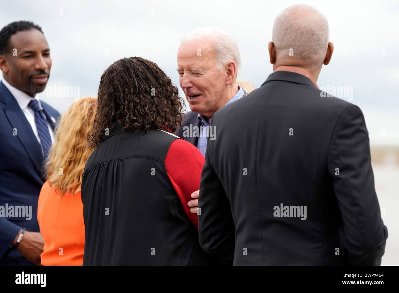 President Joe Biden greets Mereda David Johnson as her husband, Rep ...