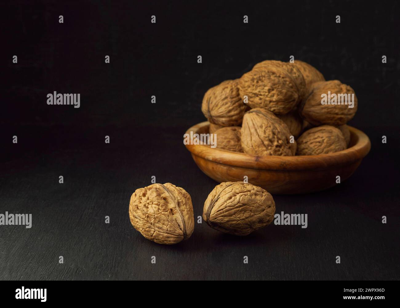Walnuts on a dark background. The concept of proper nutrition. Walnuts ...