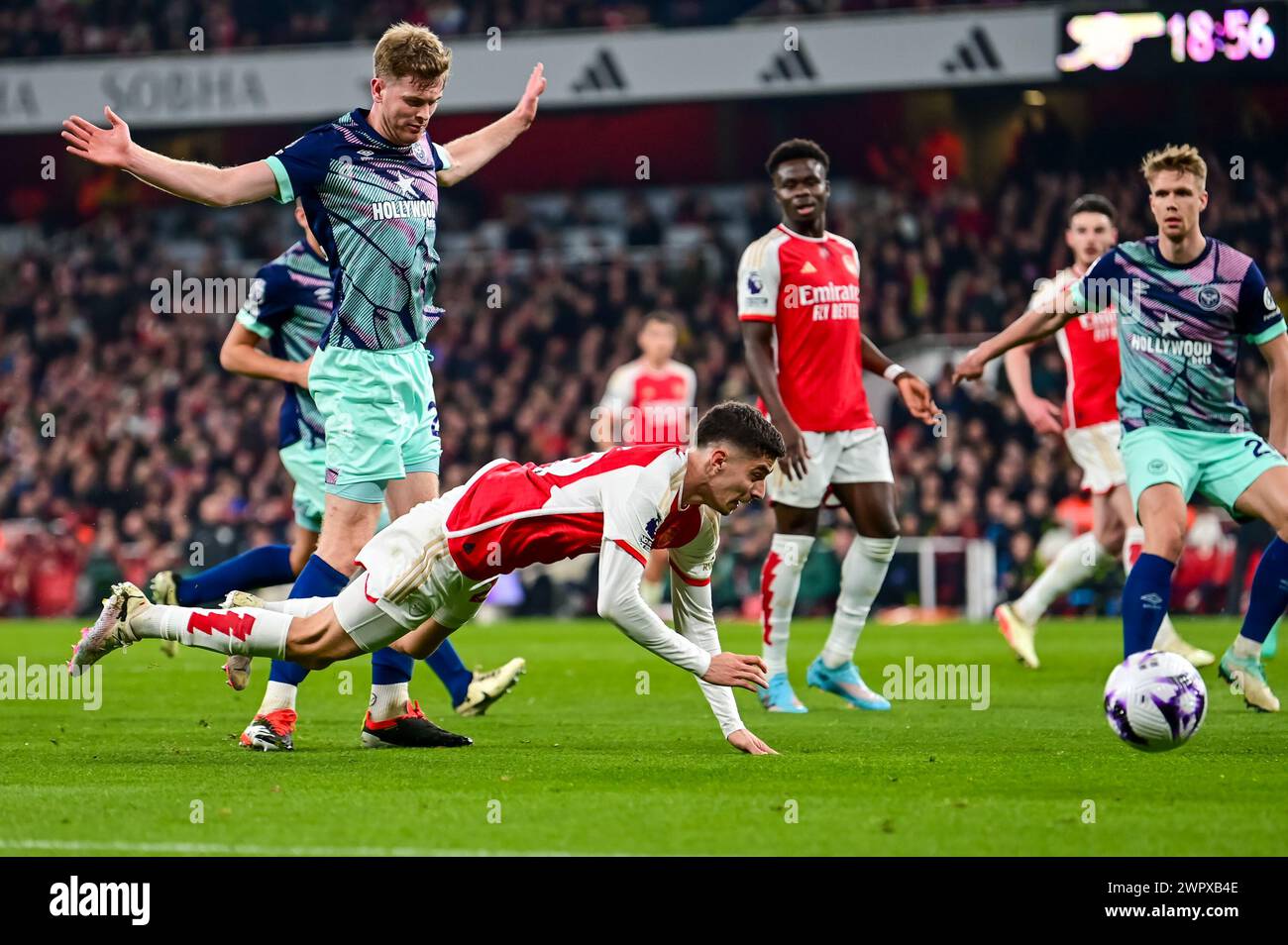 Nathan Collins of Brentford FC challenges and sends Kai Havertz of ...