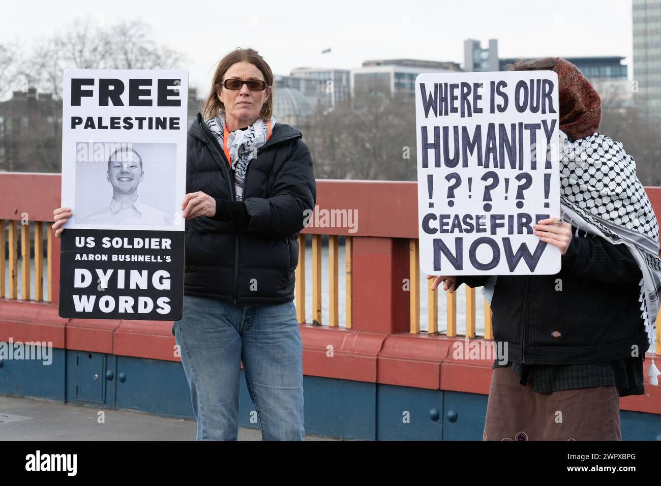 London, UK. 9 March, 2024. A protester hold a placard showing U.S ...
