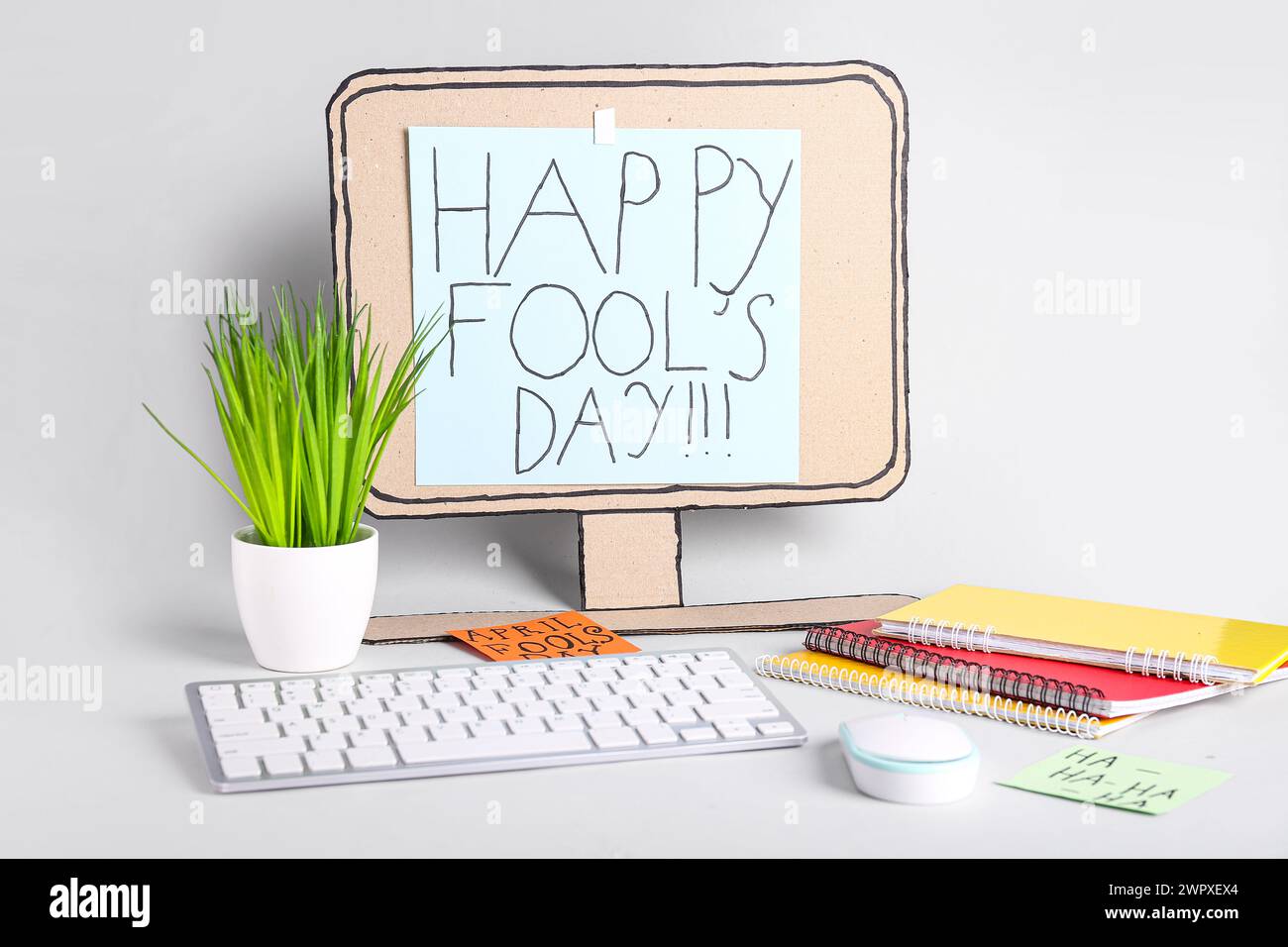 Carton computer screen, keyboard and notebooks on white background ...