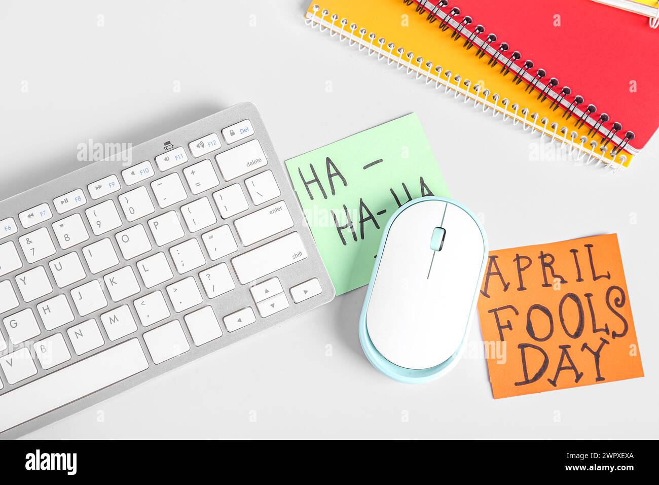Computer keyboard, sticky notes and notebooks on white background ...