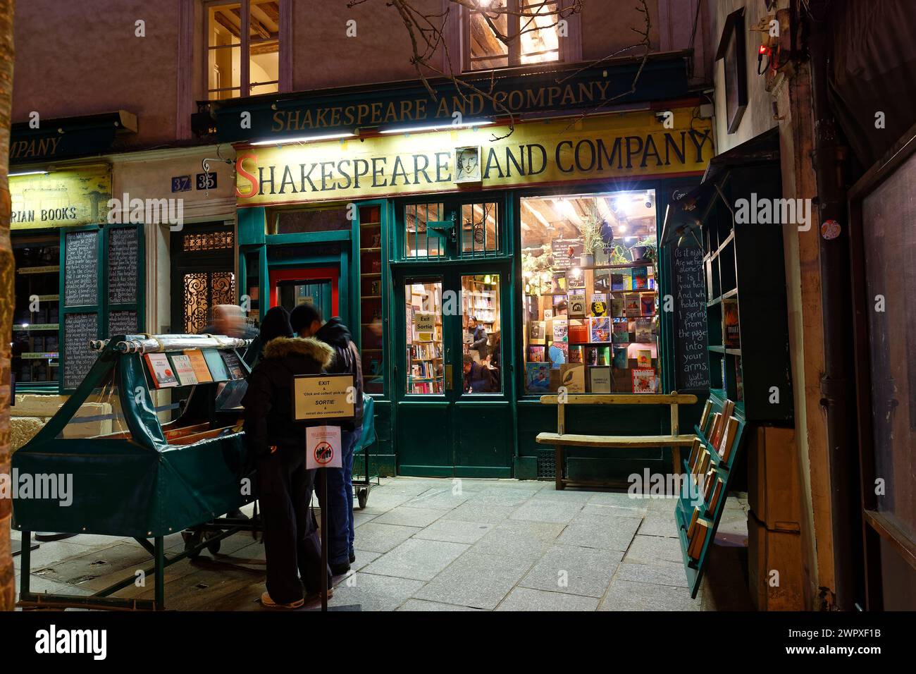 People in front of the Shakespeare and Company, a bookstore with new ...
