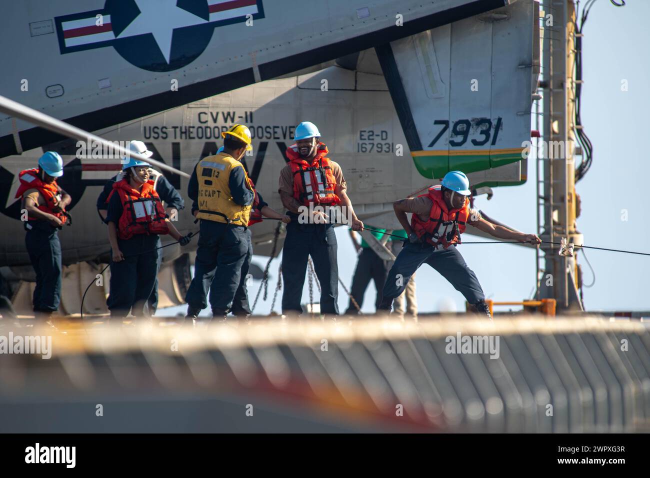 SOUTH CHINA SEA (March 4, 2024) U.S. Sailors heave around the phone and ...