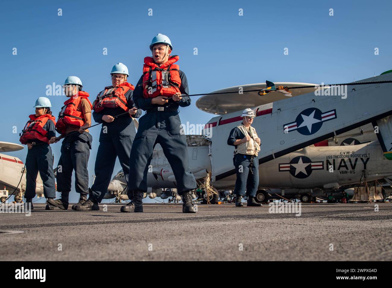 SOUTH CHINA SEA (March 4, 2024) U.S. Sailors heave around the phone and ...