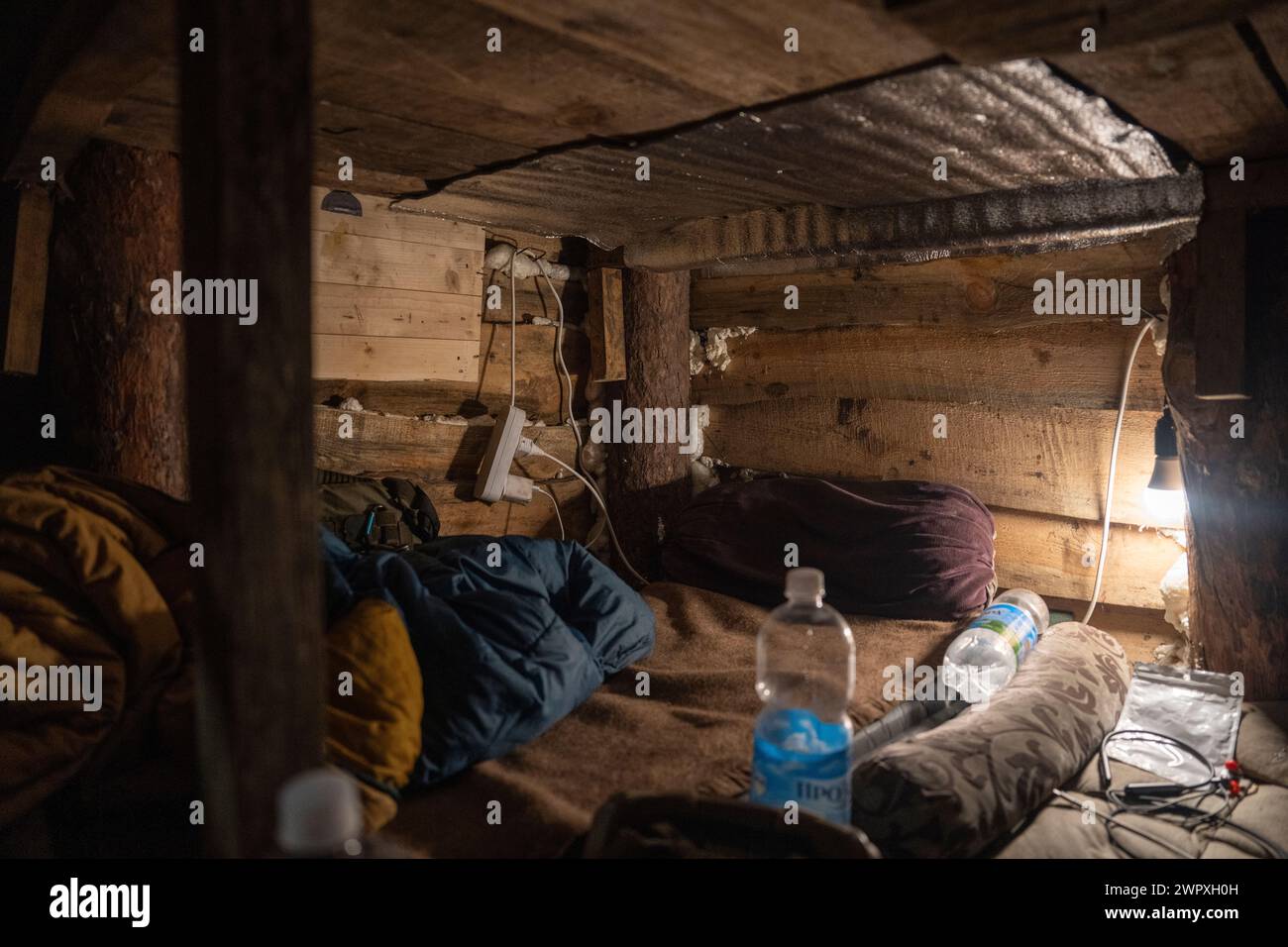 The bed of a soldier inside a blíndage used by a L119 Howitzer unit in ...