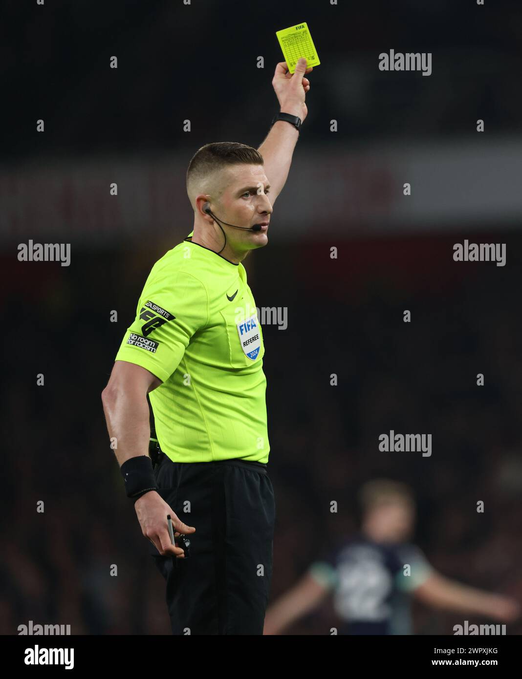 London, UK. 09th Mar, 2024. Referee Robert Jones brandishes a yellow ...
