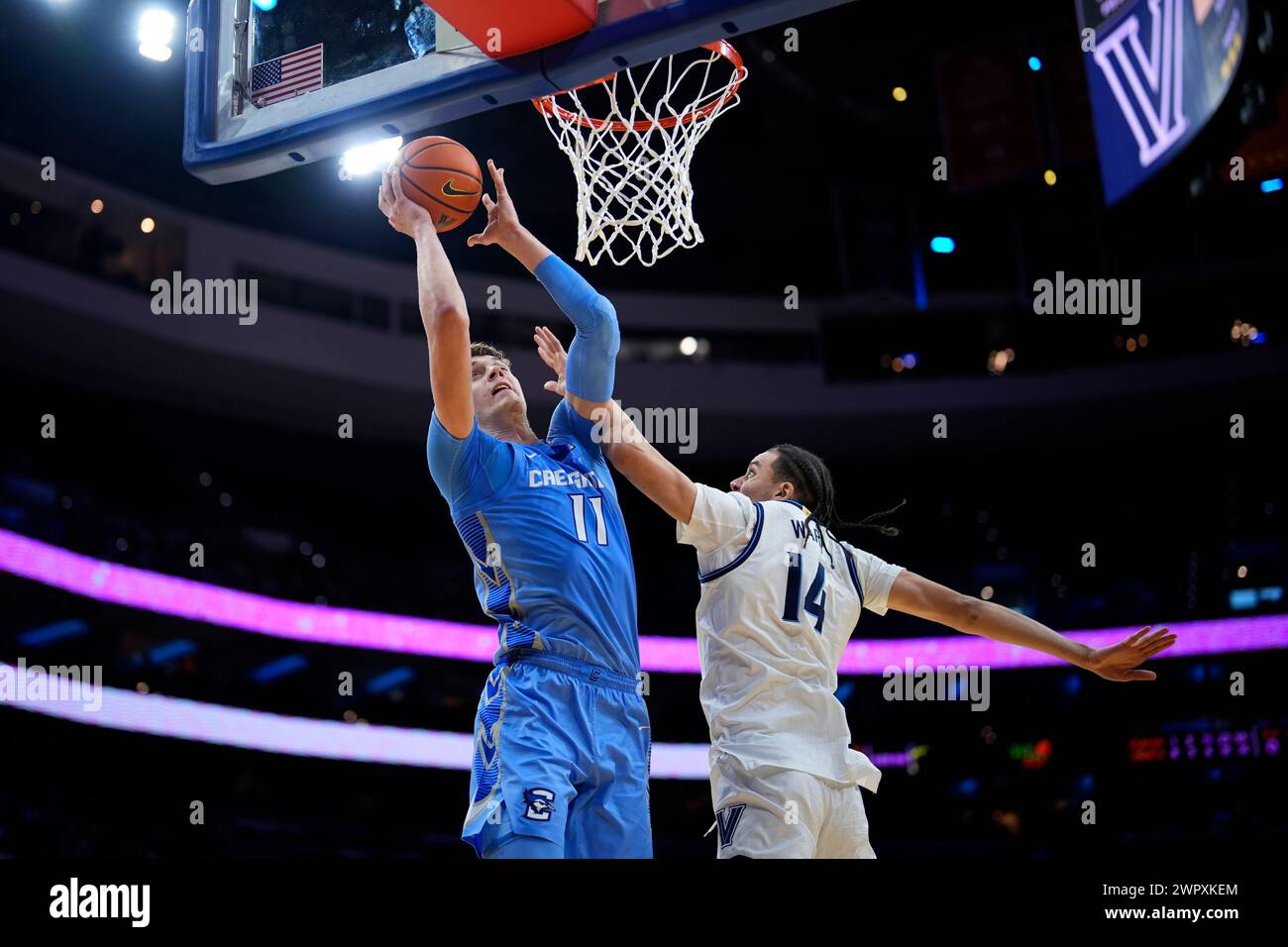 Creighton's Ryan Kalkbrenner, left, goes up for a shot against ...