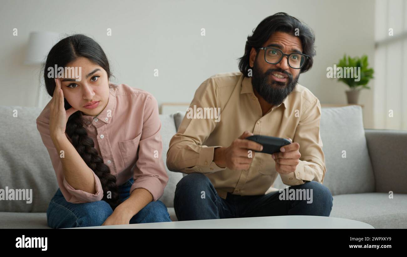 Diverse multiethnic couple at home bored angry arabian woman offend on ...