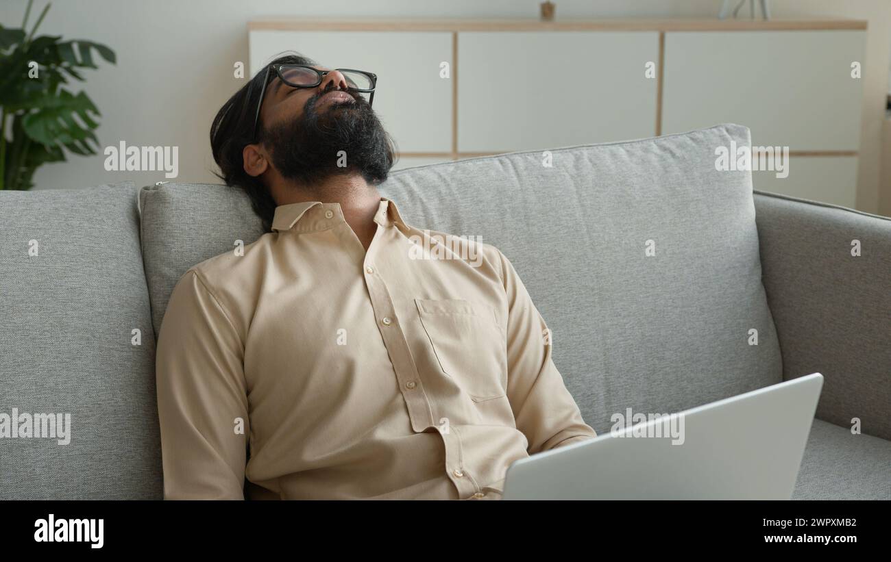 Tired exhausted freelancer working with laptop at home overworked ...