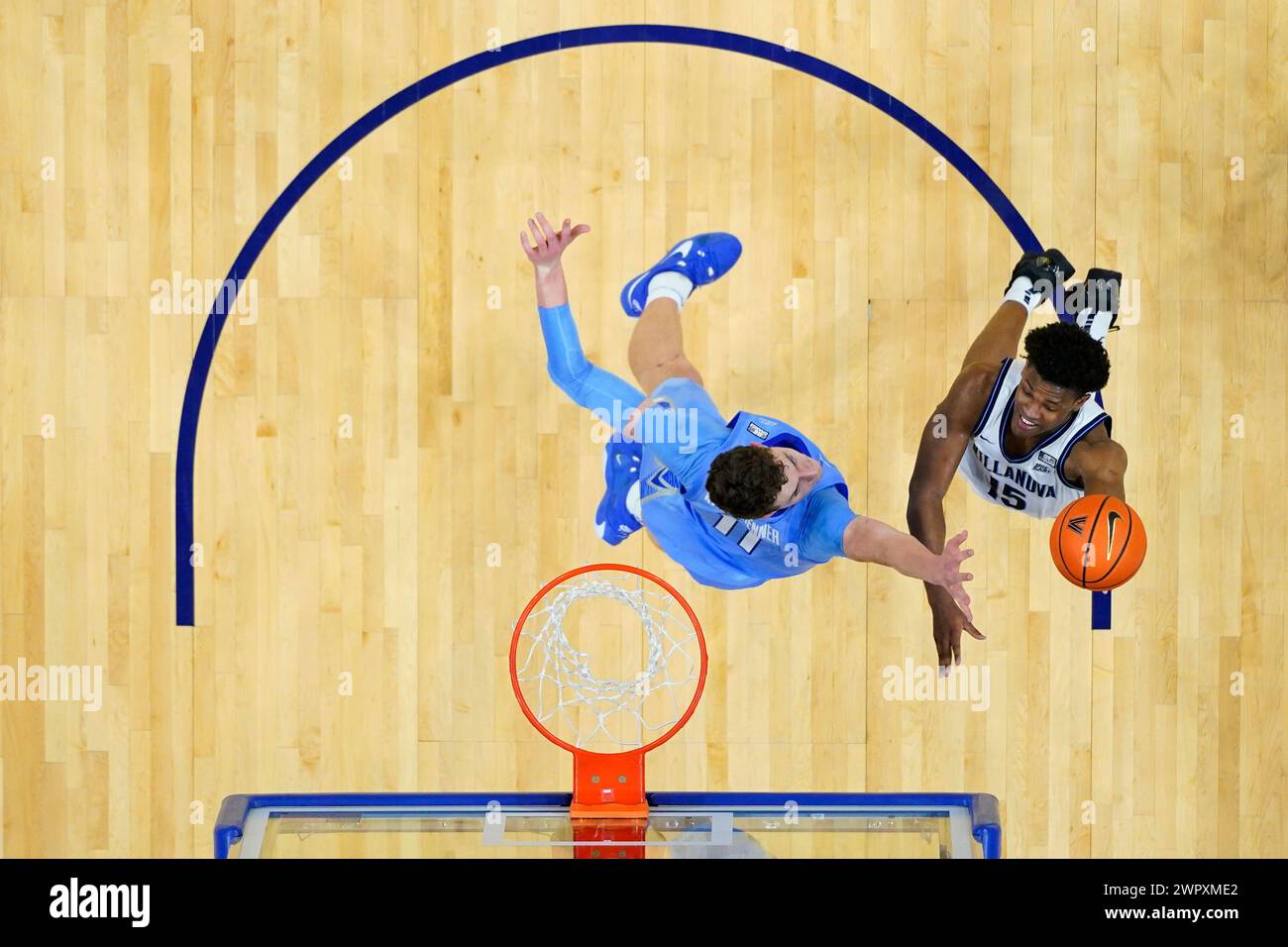 Villanova's Jordan Longino, right, goes up for a shot against Creighton ...