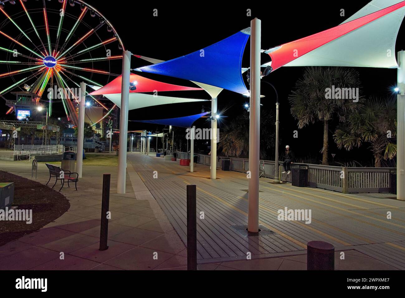 Illuminated boardwalk, ferris wheel at night in Myrtle Beach, South ...