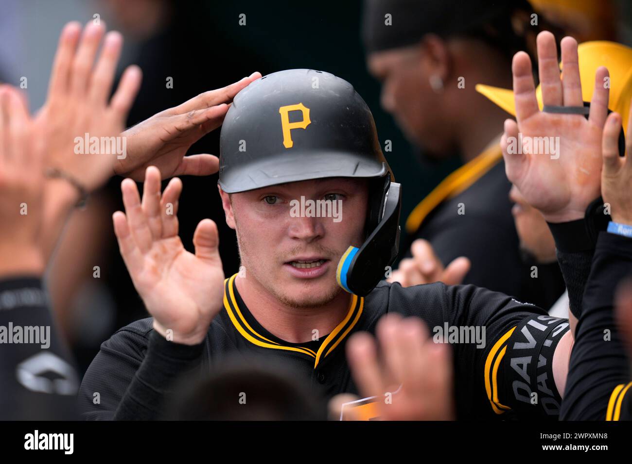 Pittsburgh Pirates' Henry Davis celebrates in the dugout after hitting ...