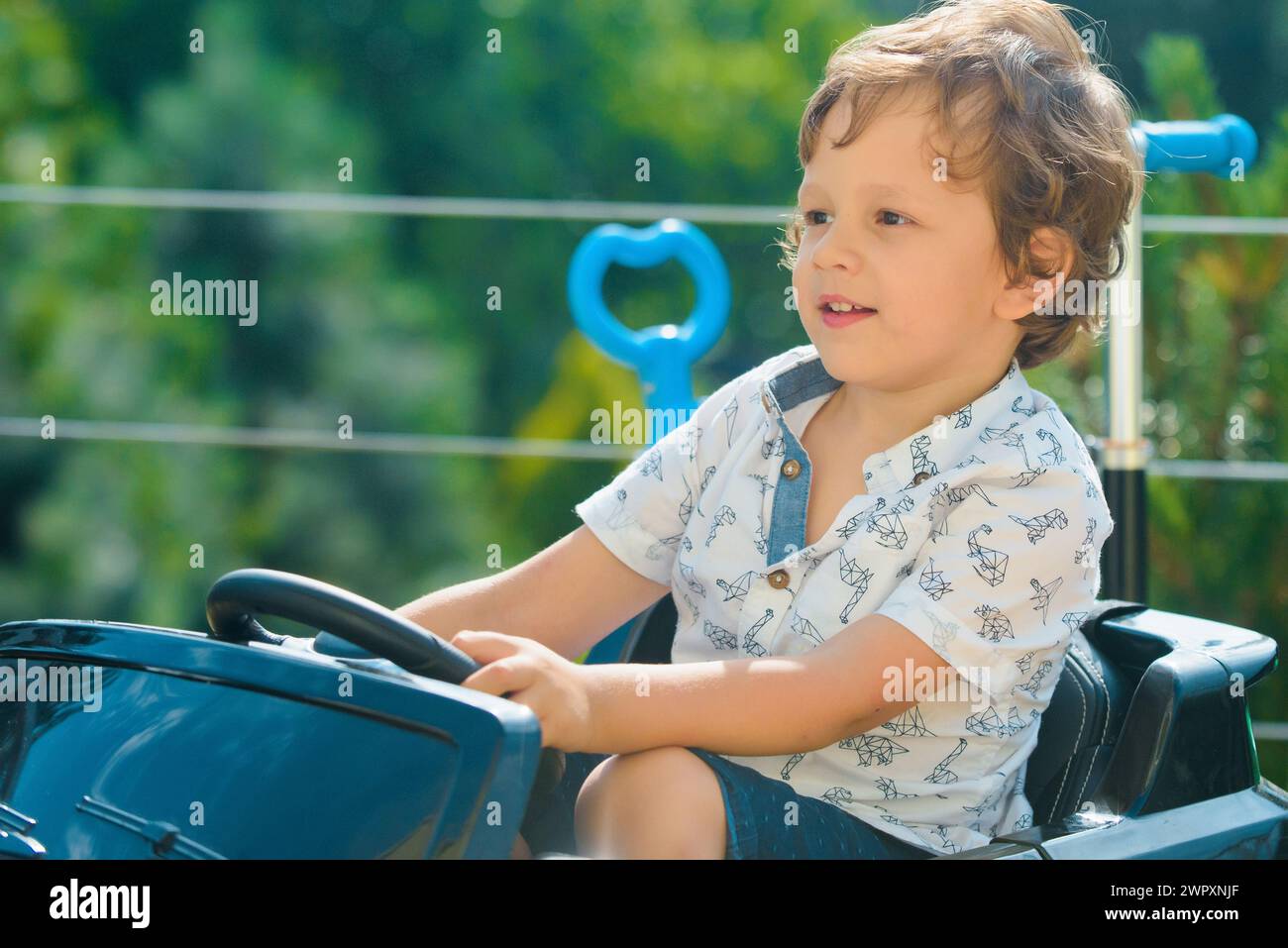 Kid Driver. Cute little baby boy pretending to drive. Kid in car with ...