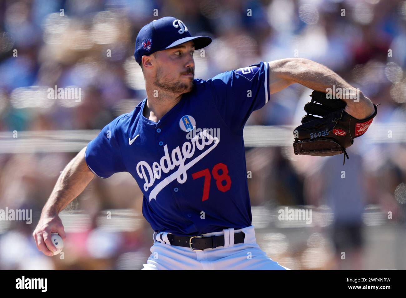 Los Angeles Dodgers starting pitcher Michael Grove throws in the first ...