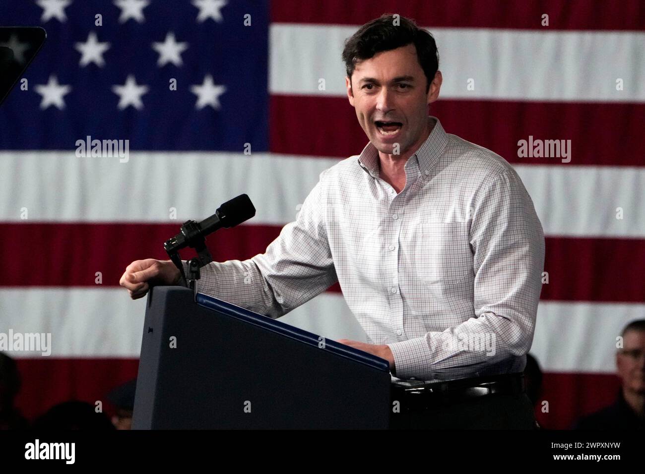 Sen. Jon Ossoff, D-Ga., speaks before President Joe Biden at a campaign ...