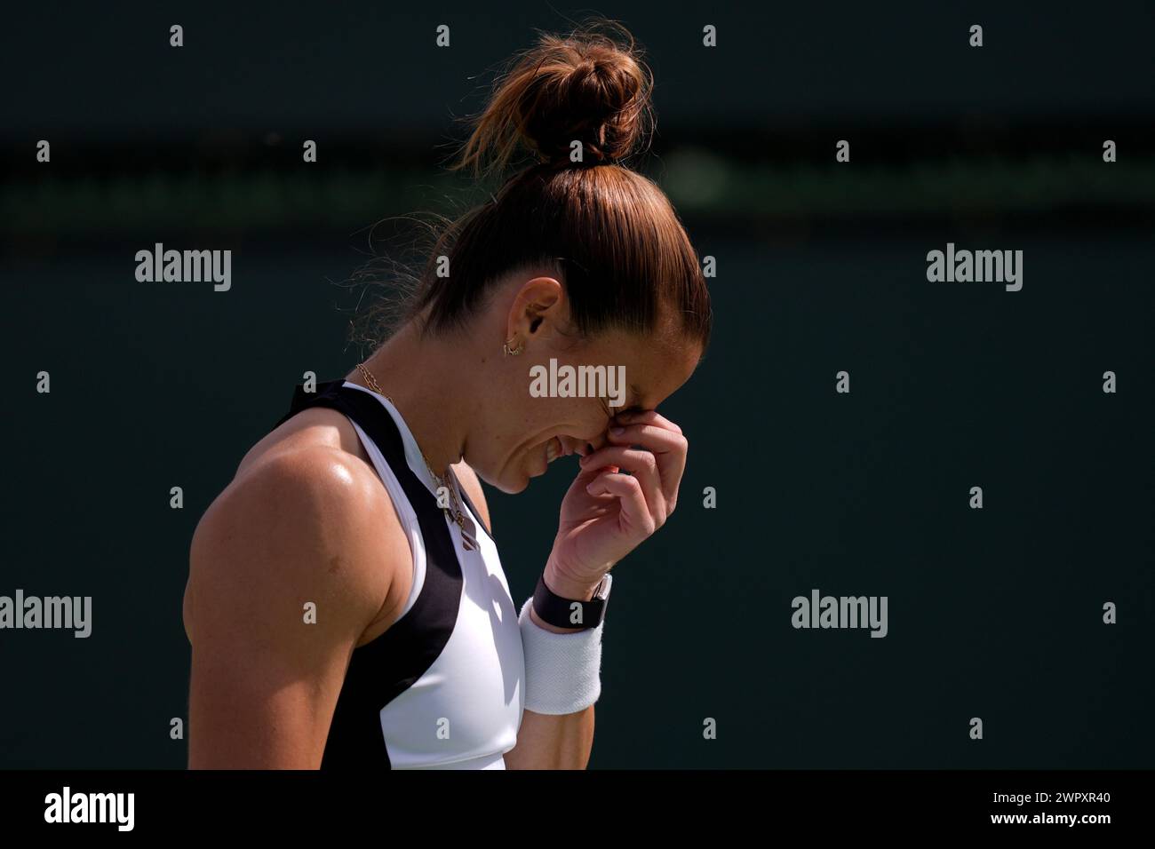 Maria Sakkari, of Greece, reacts after losing a point to Diana Shnaider ...