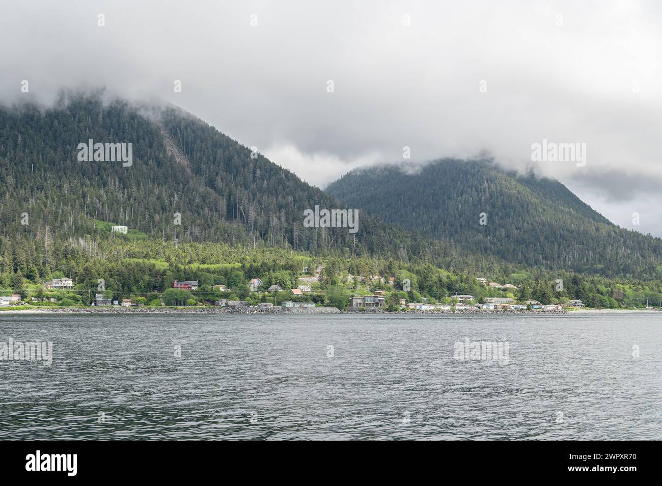 Sitka Sound and Sitka town with cloud topped mountains behind, Alaska ...