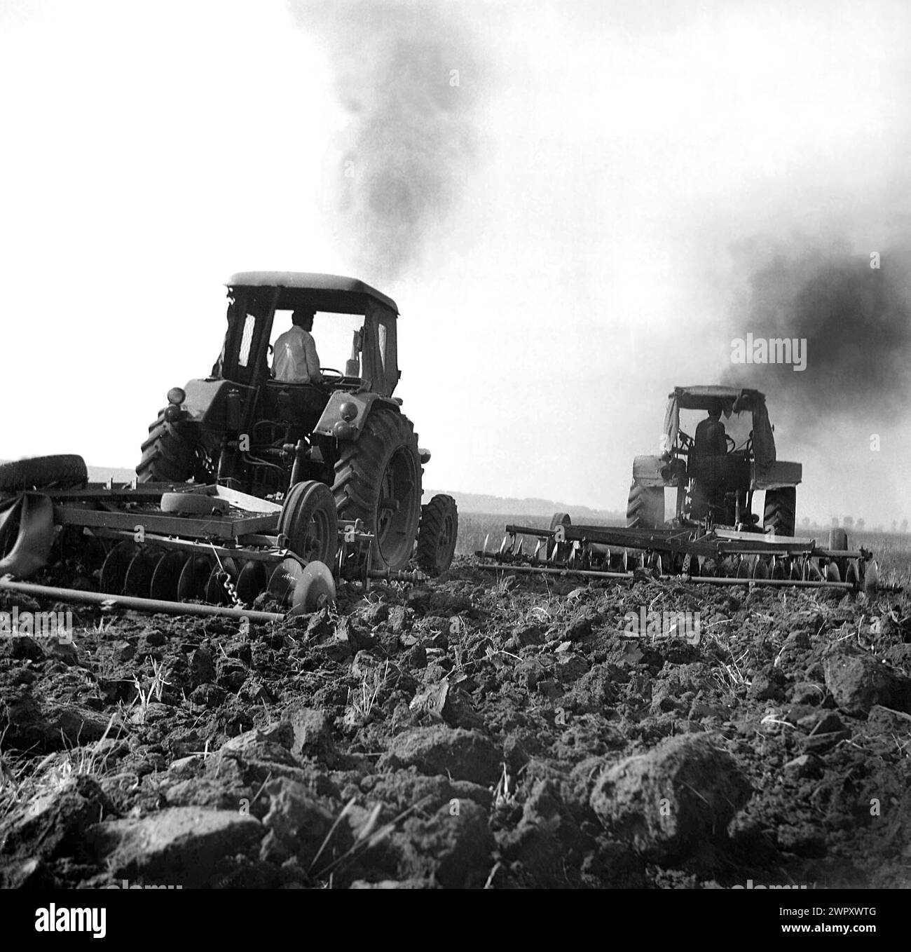 1970s tractor plowing a field Black and White Stock Photos & Images - Alamy