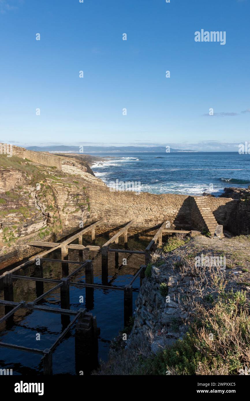 scenic coastal view with rocky terrain, an old stone structure, and the ...