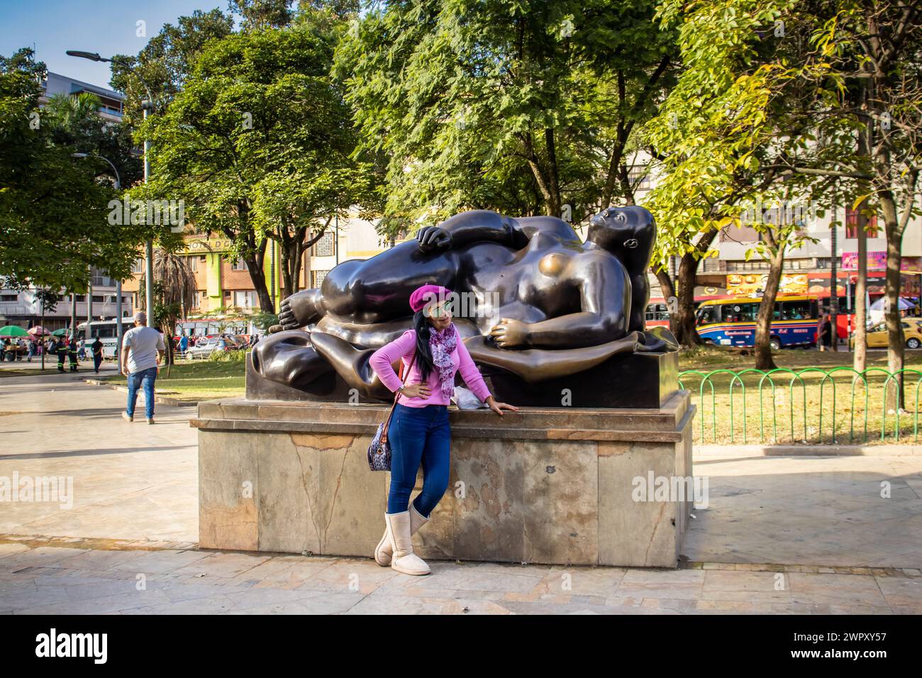 MEDELLIN, COLOMBIA - JANUARY 17, 2024: Tourist visiting the bronze ...
