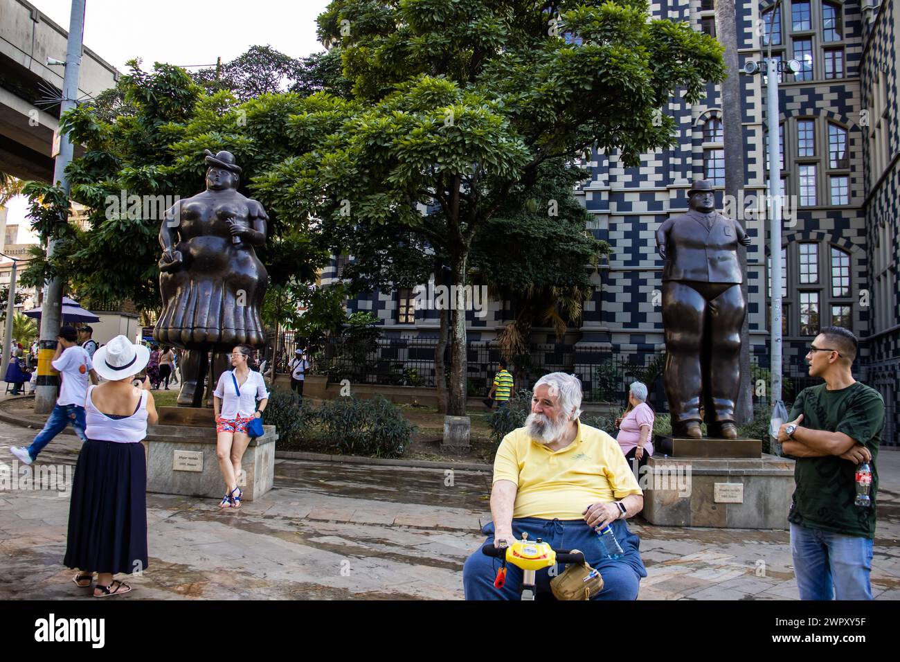MEDELLIN, COLOMBIA - JANUARY 17, 2024: Tourists visiting the bronze ...