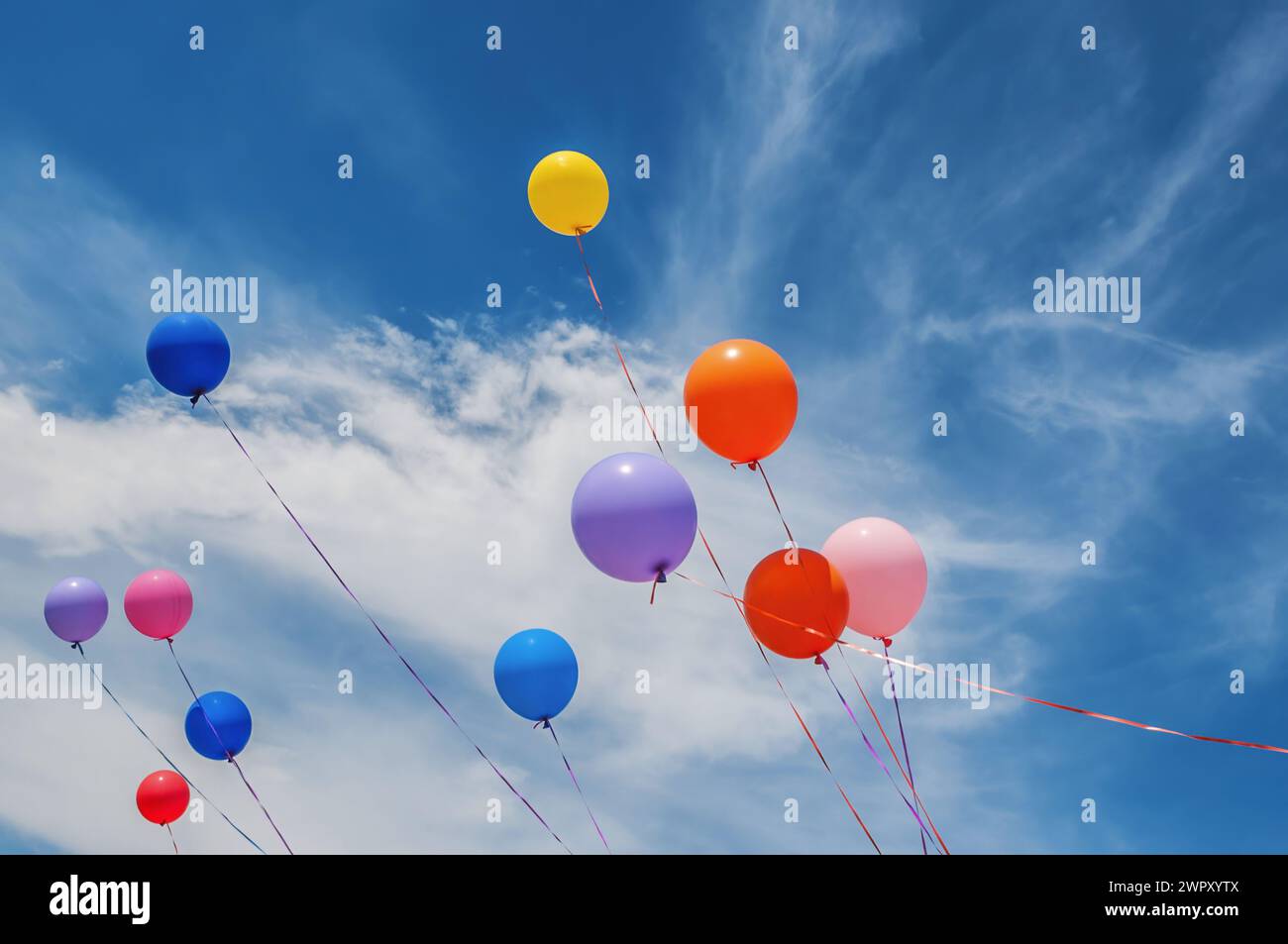 Colorful balloons fly in the sky hi-res stock photography and images ...
