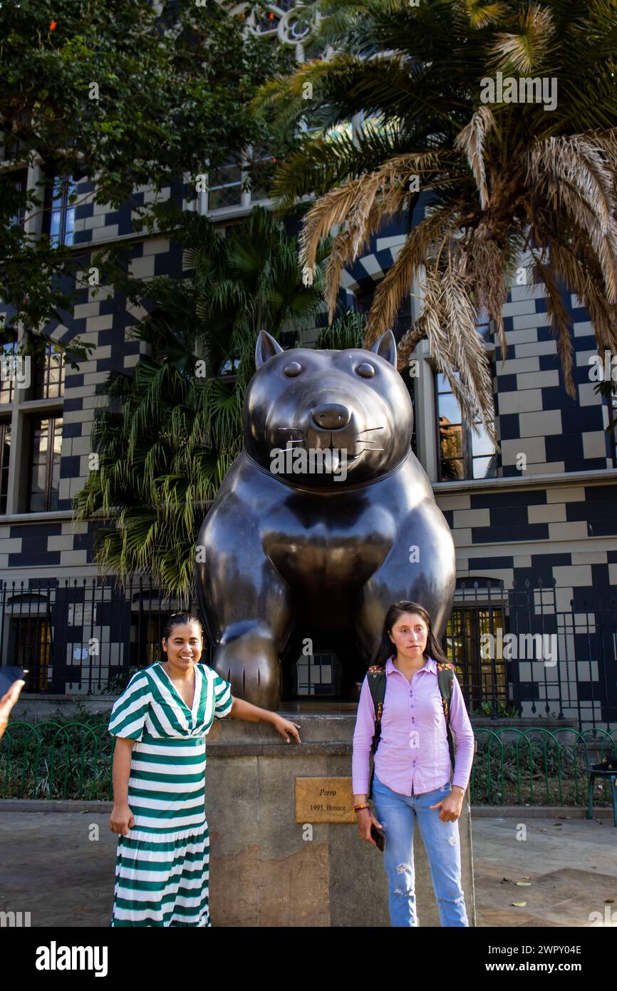 MEDELLIN, COLOMBIA - JANUARY 17, 2024: Tourists visiting the bronze ...