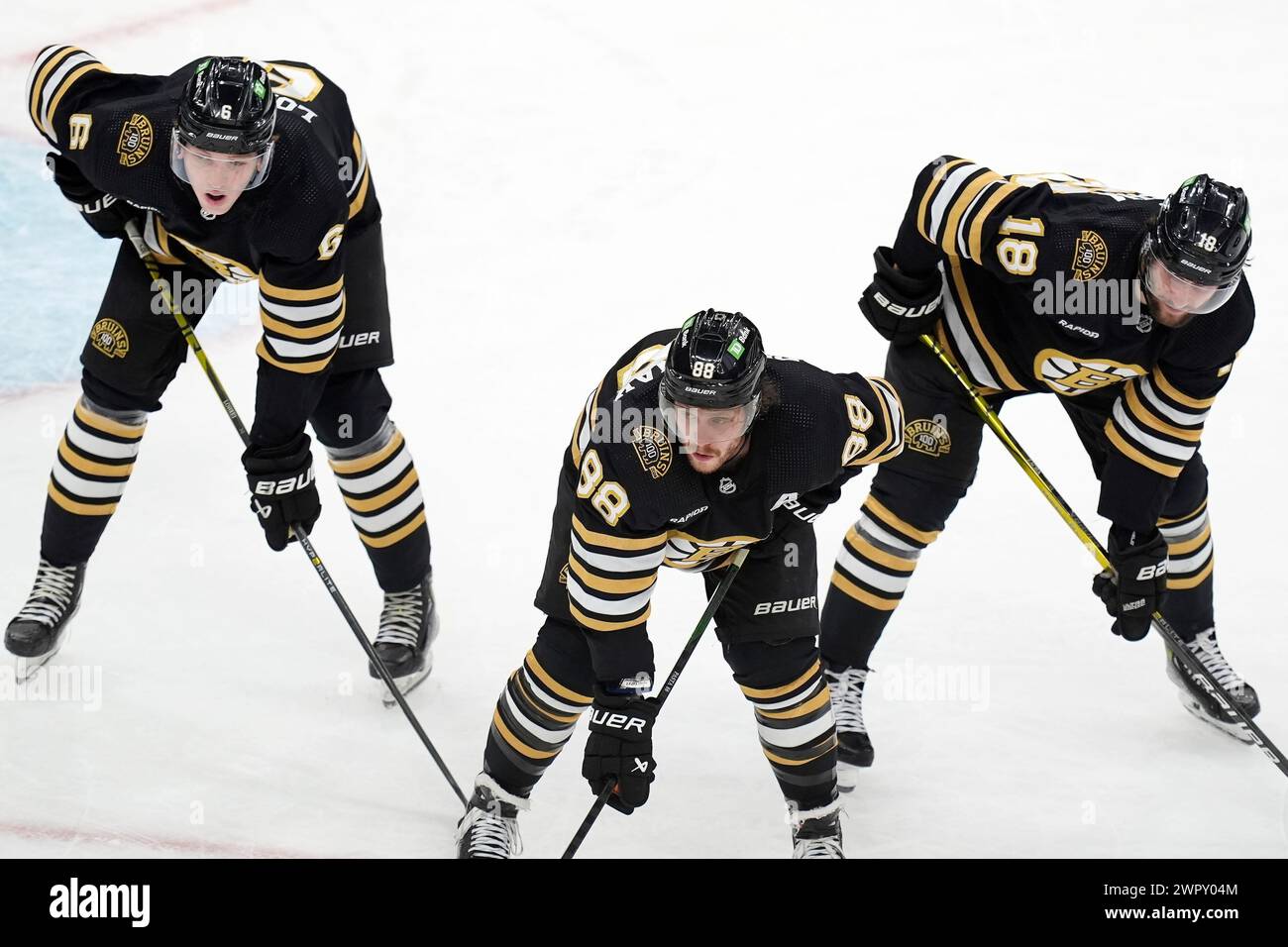 Boston Bruins' Mason Lohrei (6), David Pastrnak (88) and Pavel Zacha ...
