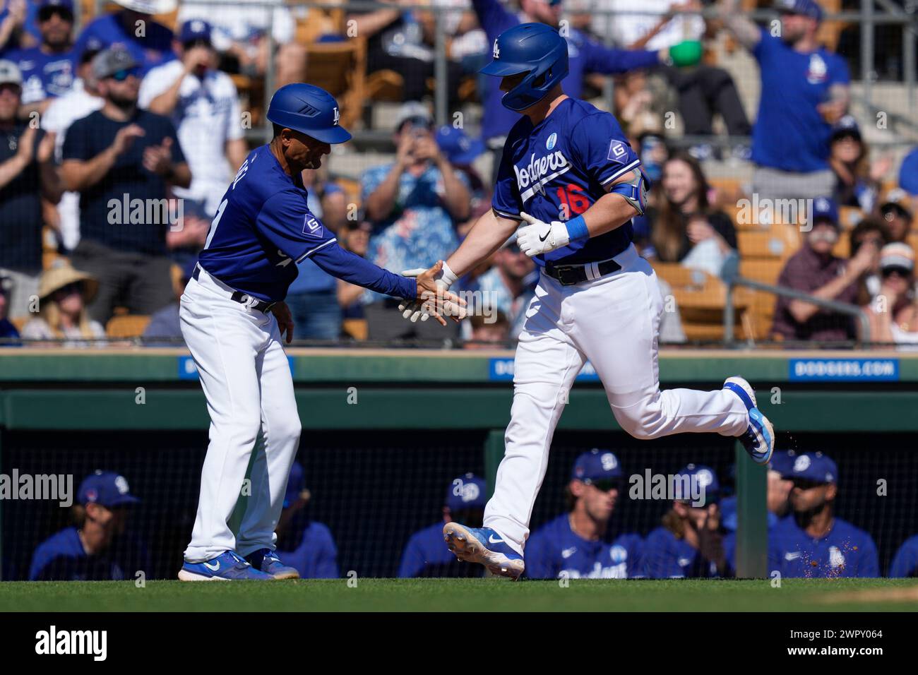 Los Angeles Dodgers' Will Smith (16) celebrates with third base coach ...