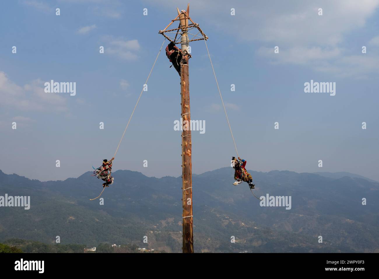 Dancers swing from a pole using ropes during the "Danza del Palo ...