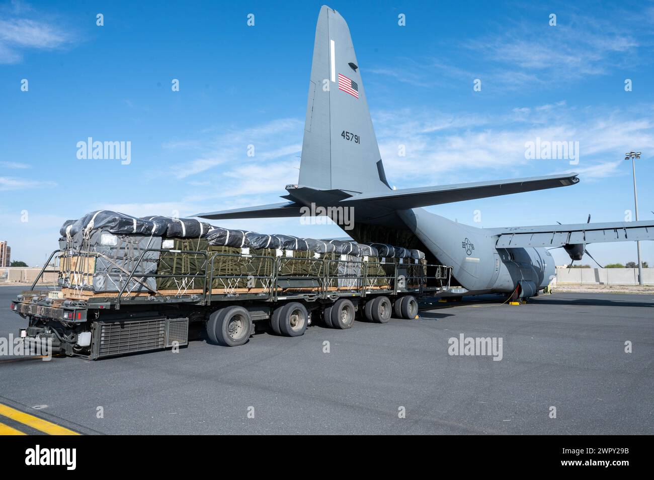 U.S. Air Force loadmasters load pallets of humanitarian aid destined ...