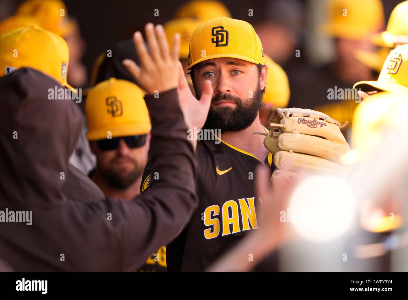 San Diego Padres starting pitcher Matt Waldron is greeted in the dugout ...