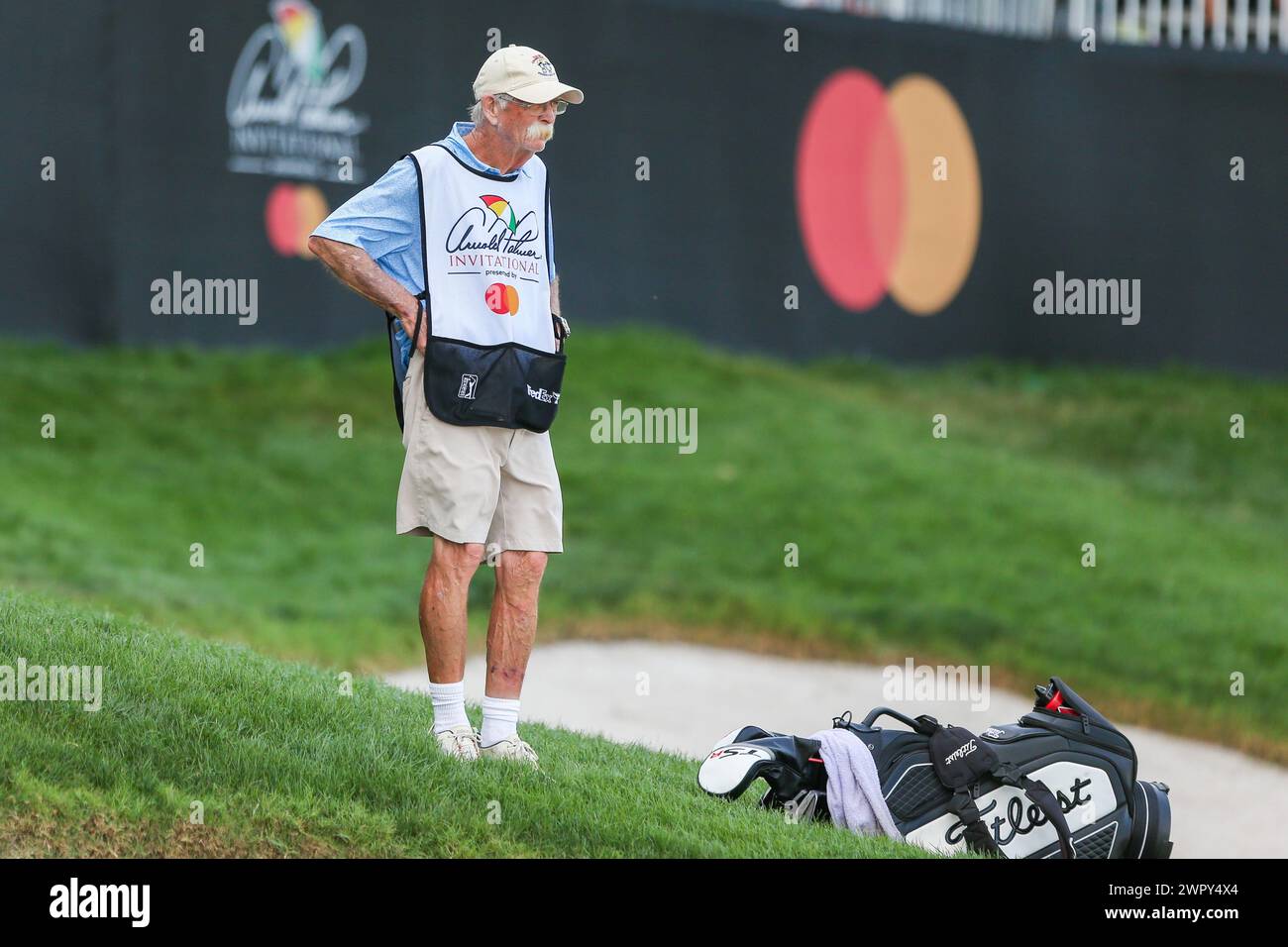 Orlando, Florida, USA. 9th Mar, 2024. Caddie Mike Cowan waits on the ...