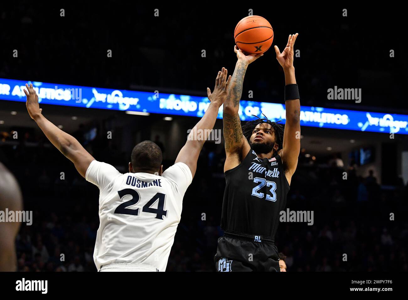 Marquette forward David Joplin (23) shoots over Xavier guard Trey Green ...